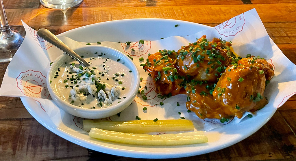 Crab Rangoon nachos and hickory-smoked chicken wings at Longfellow Bar ...