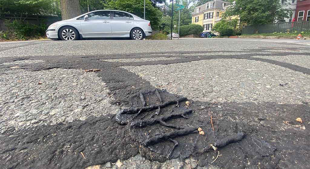 As the temperatures climbed, asphalt patchwork melted on roads in ...